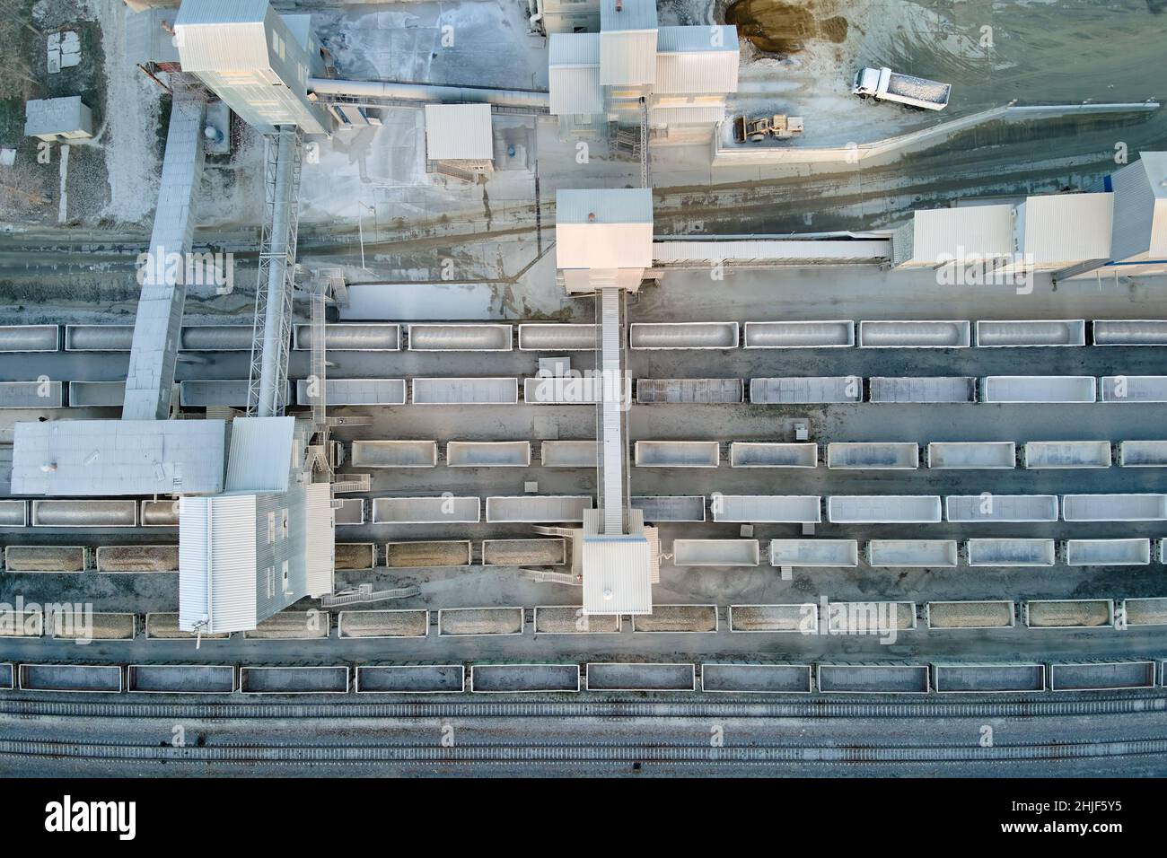 Aerial view of cargo train loaded with crushed sandstone materials at ...