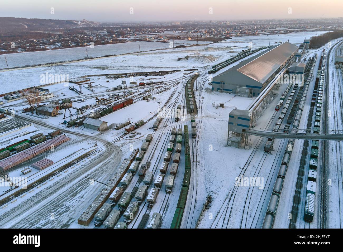 Aerial view of cargo train cars loaded with construction goods at ...