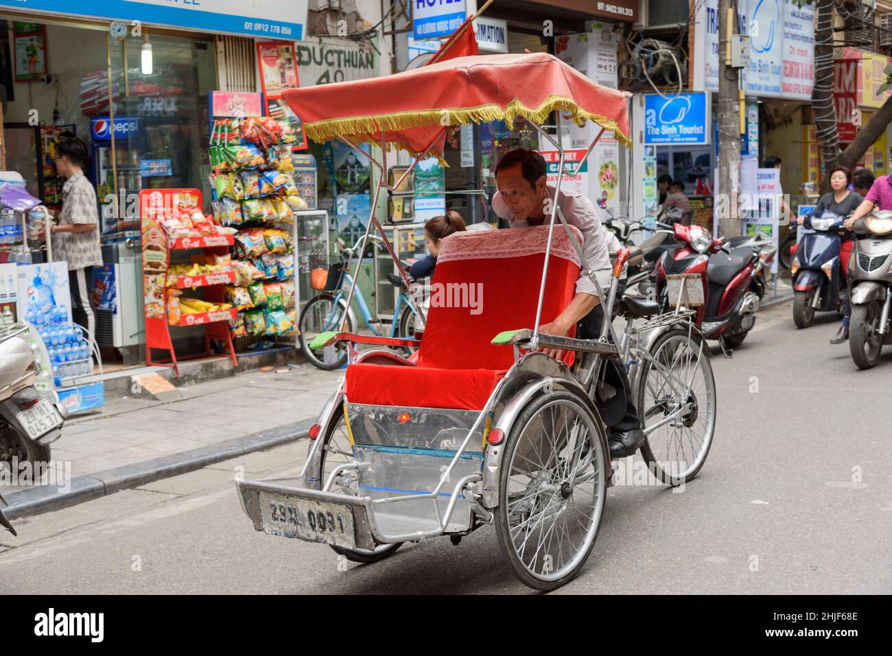 Bicycle rickshaw (cyclo or pedicab) in the streets of the Old Quarter ...