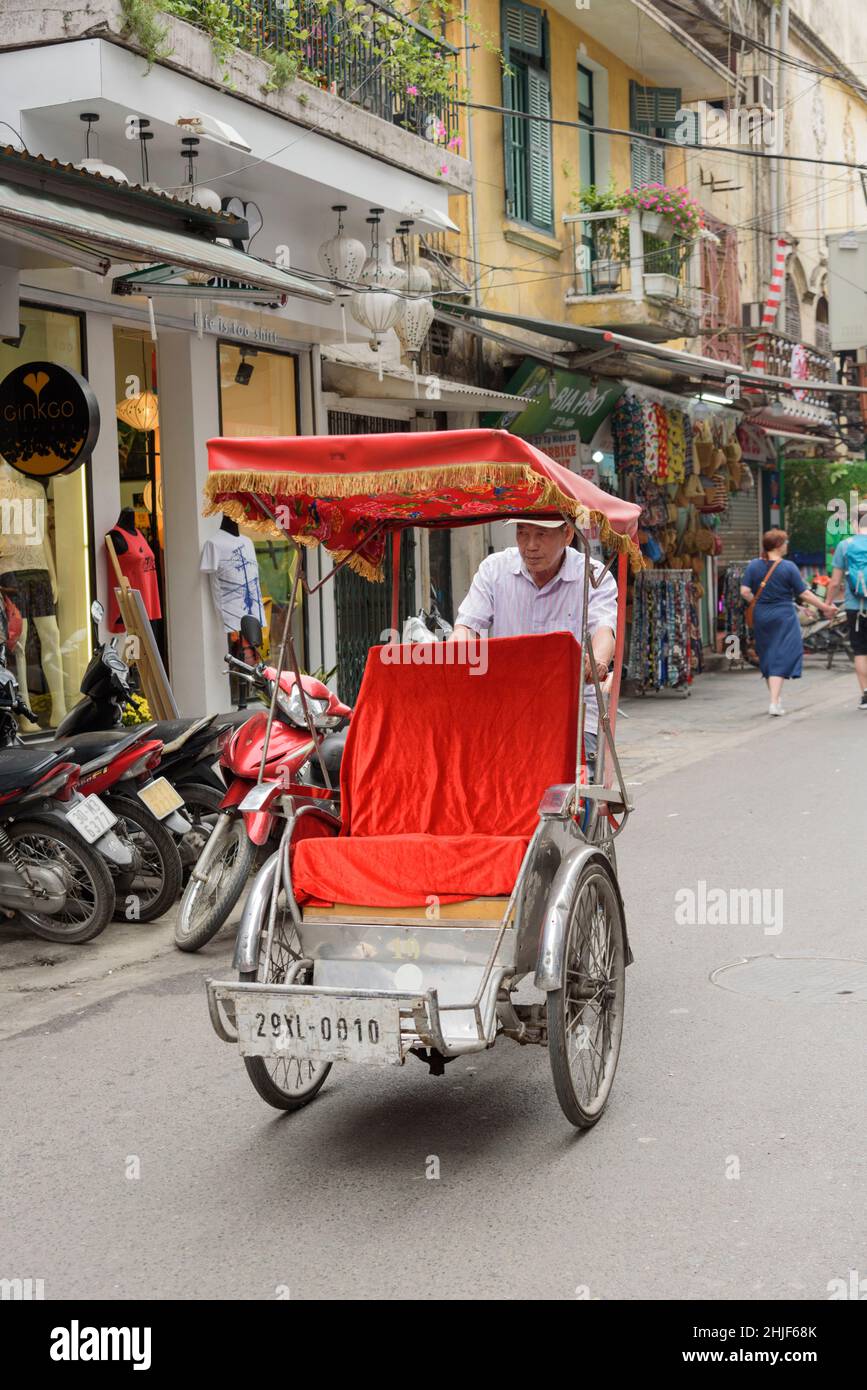 Bicycle rickshaw (cyclo or pedicab) in the streets of the Old Quarter ...