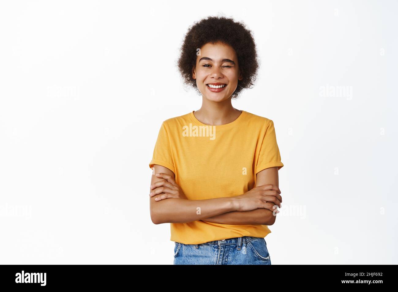 Cool and confident black woman winking, smiling assertive, give a wink ...