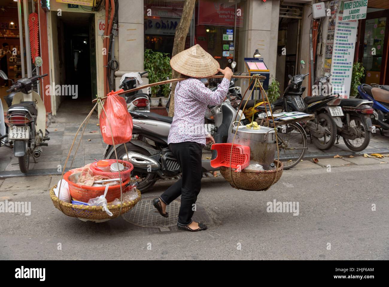A traditional food vendor selling their produce on the streets of the ...