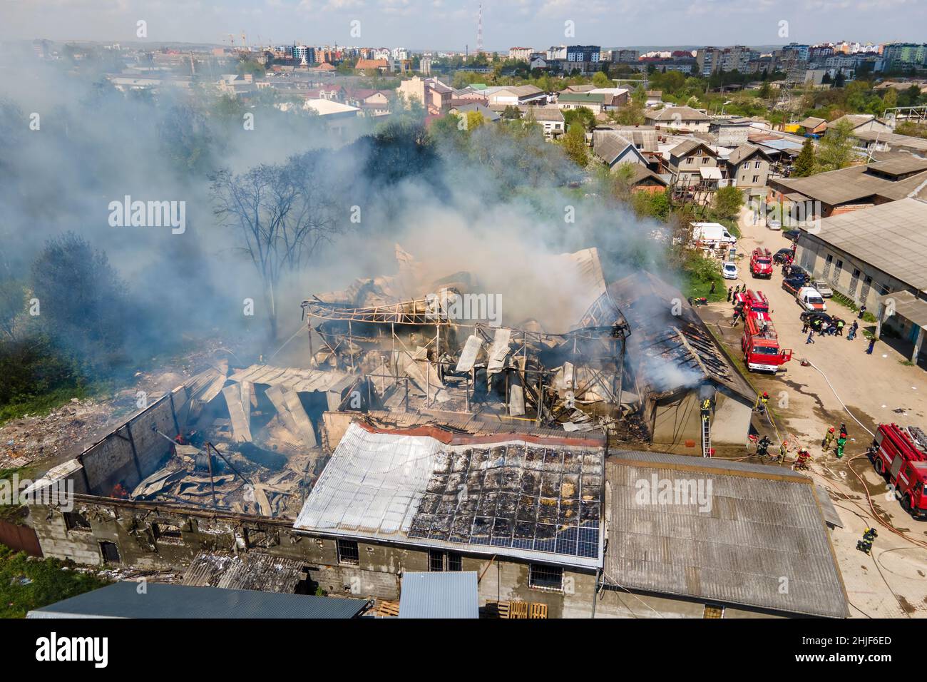 Firefighters extinguishing factory hi-res stock photography and images ...