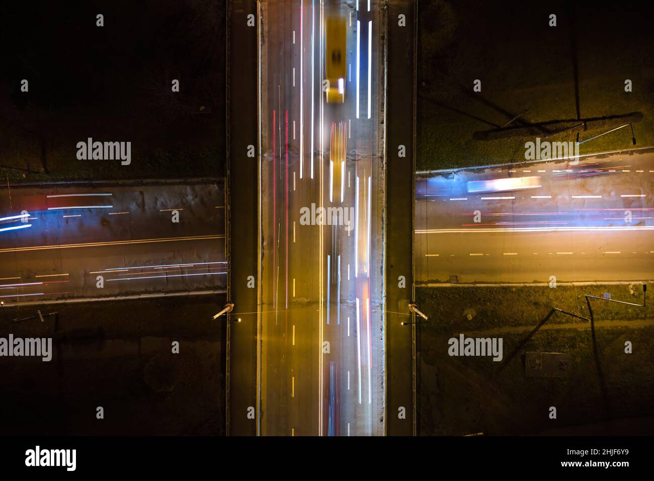 Aerial view of road intersection with fast moving heavy traffic at ...