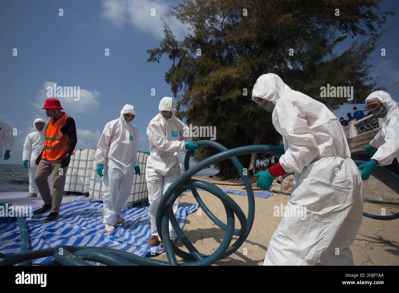 Navy soldiers wearing Personal Protective Equipment (PPE) suits prepare ...