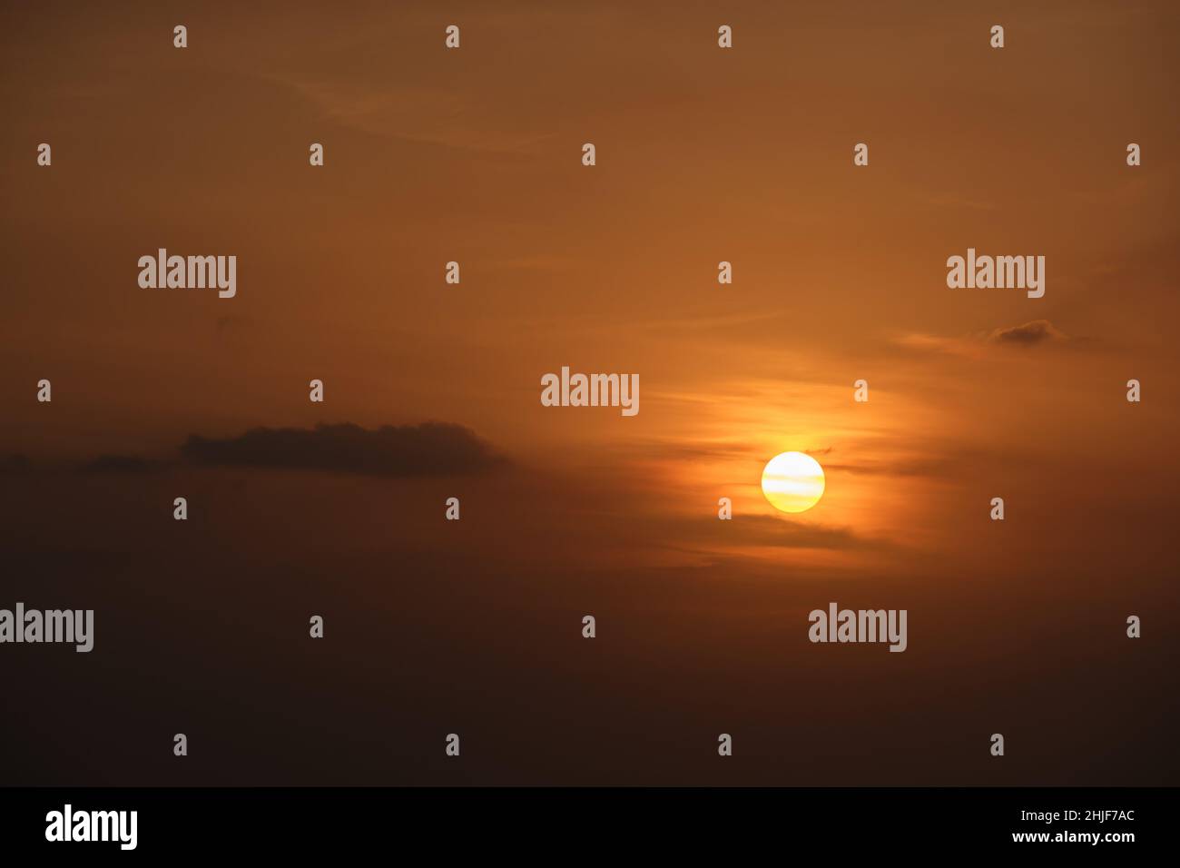 Bright colorful sunset sky with rays of setting sun and vivid dark ...