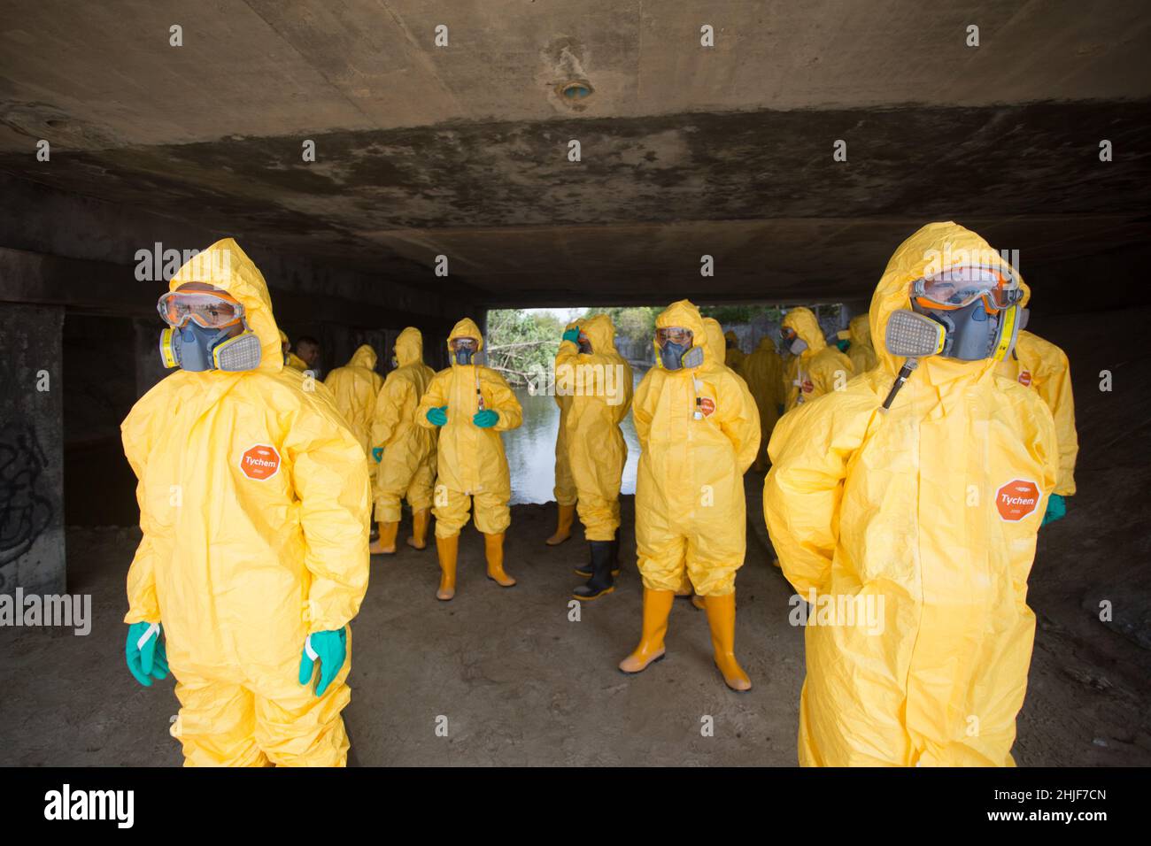 Navy soldiers wearing Personal Protective Equipment (PPE) suits prepare ...