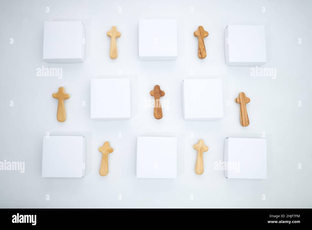 Top view of two wooden crosses on white boxes on a white surface Stock ...