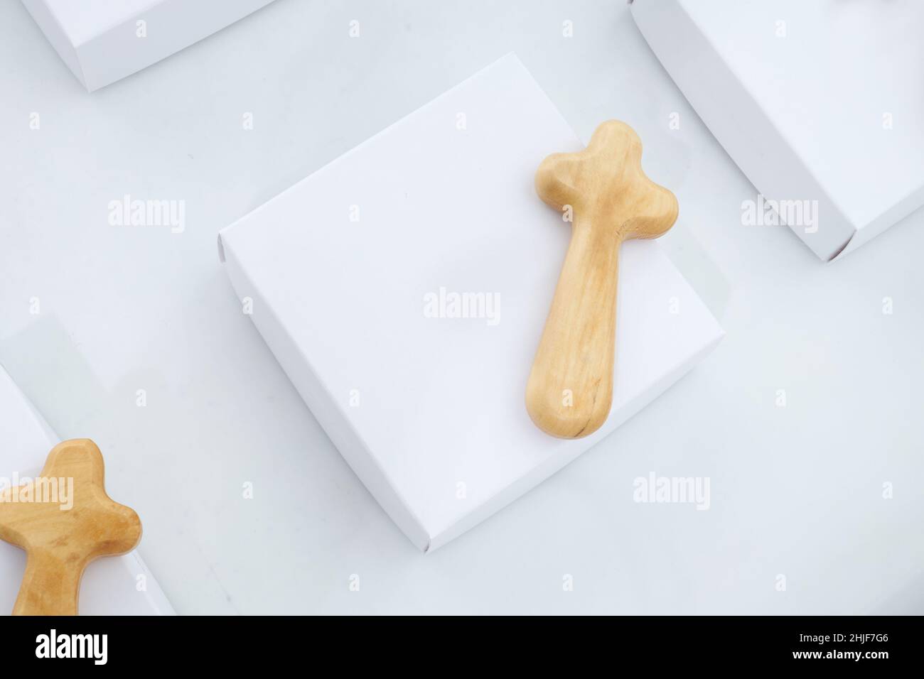 Photo of two wooden crosses on white boxes on a white surface Stock ...