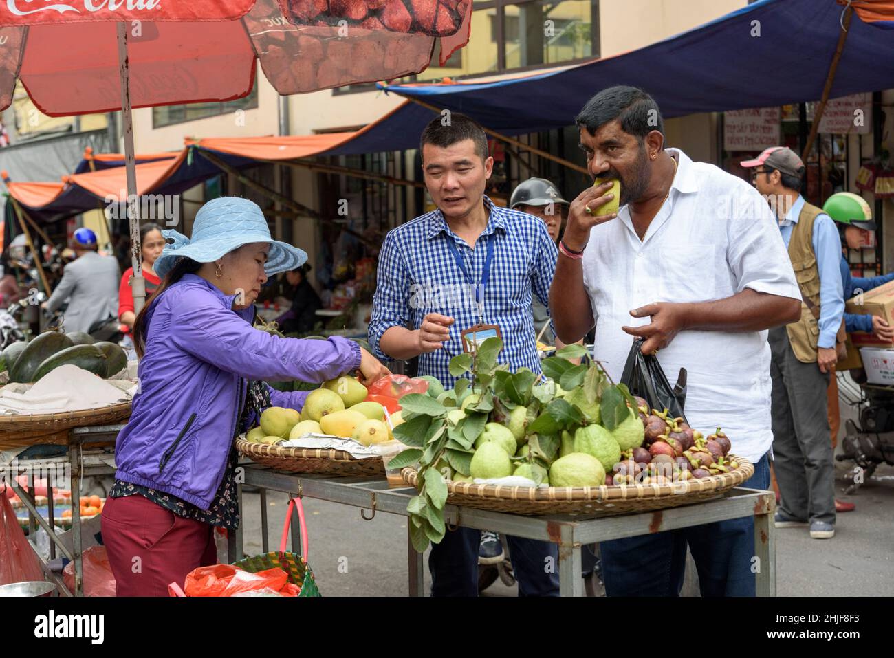 A traditional food vendor selling their produce on the streets of the ...