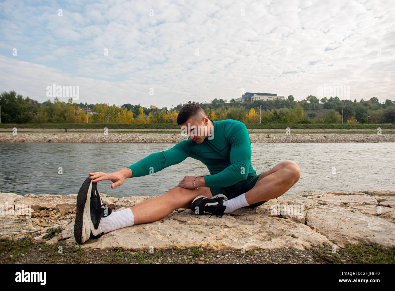 Man stretching by the riverside hi-res stock photography and images - Alamy