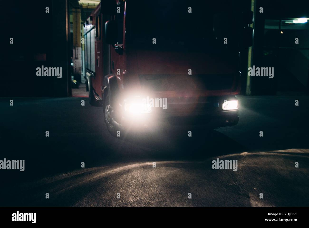 Firefighting vehicle responding to fire emergency situation Stock Photo ...