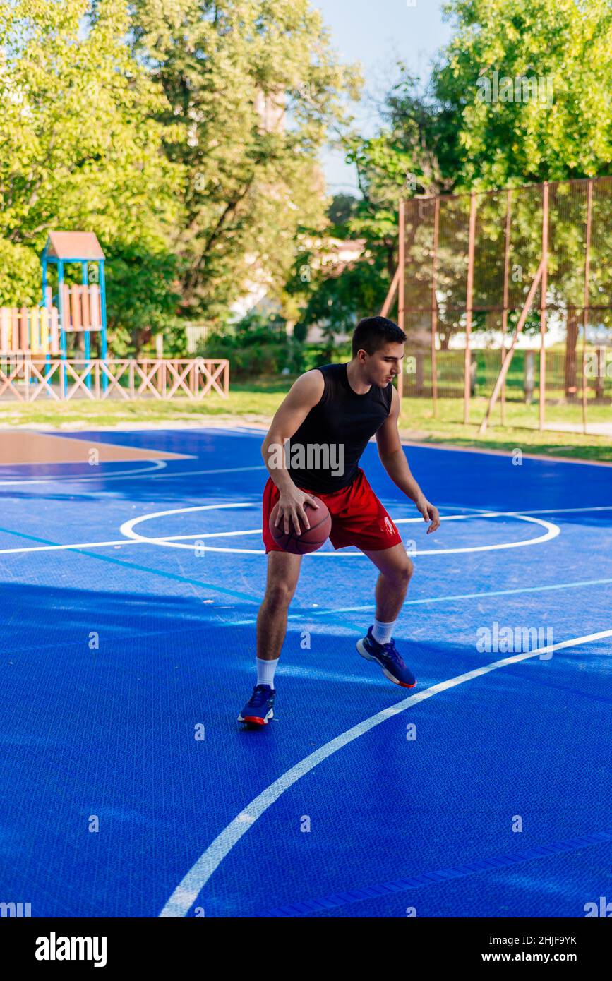 Basketball player jump shooting and playing basketball Stock Photo - Alamy