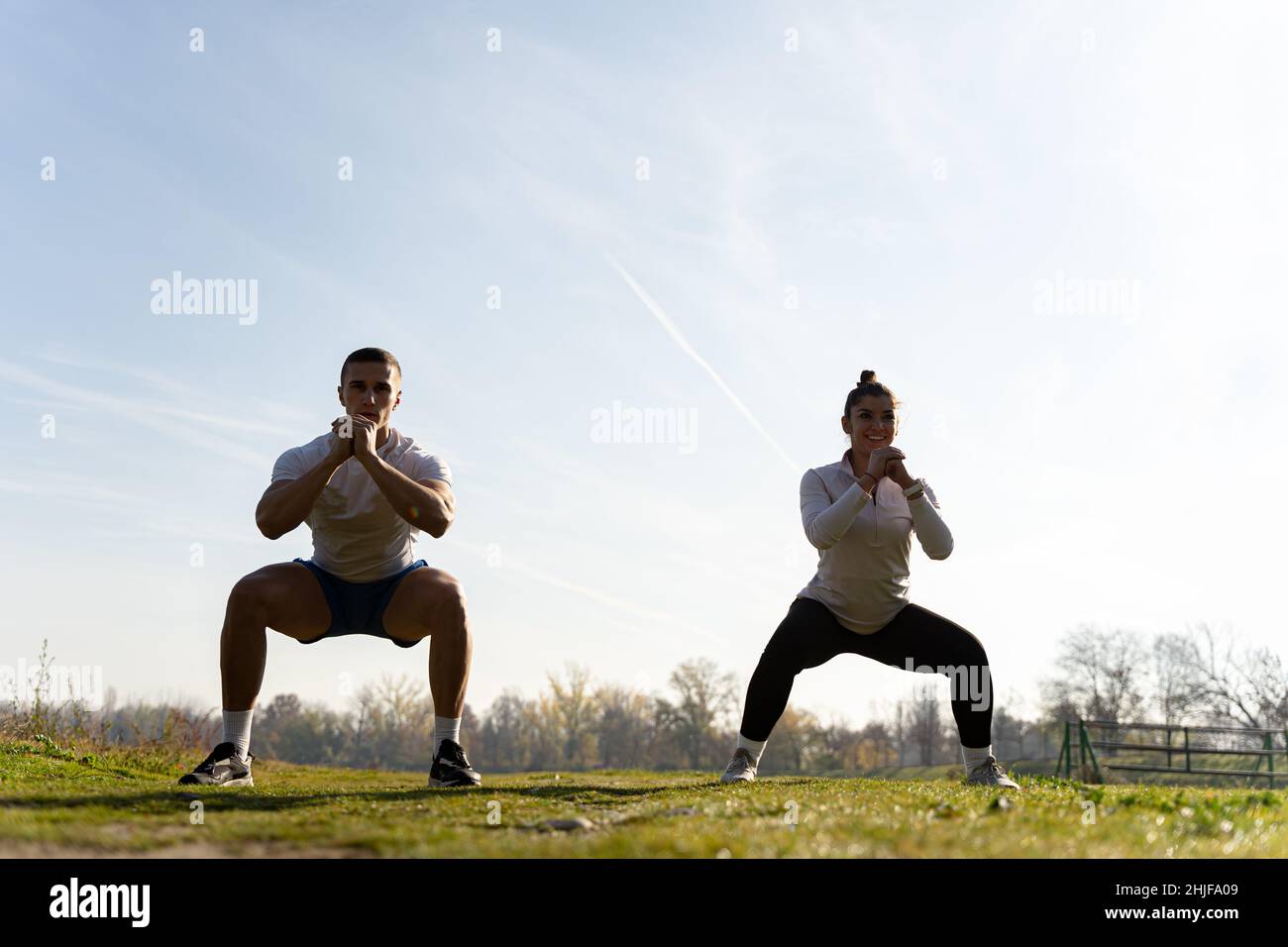 Two amazing and attractive fit friends are doing squad exercise Stock ...