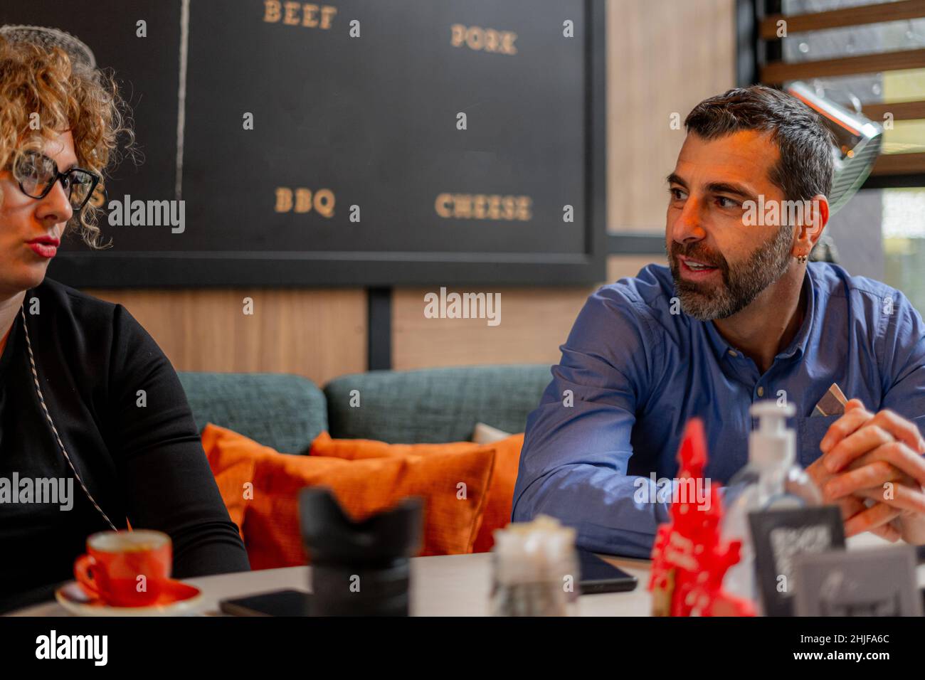 Two amazing and beautiful adult businesspeople are talking Stock Photo ...