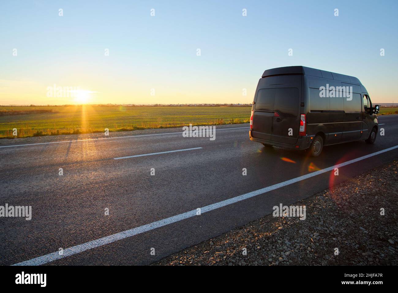 Small cargo van driving on highway hauling goods. Delivery ...