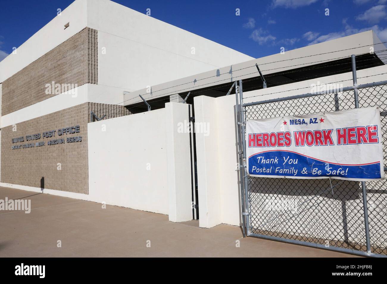 A Heroes Work Here Sign hangs outside of the Mesa Desert Post Office ...