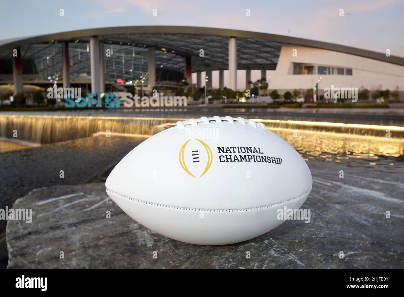 A football with the College Football Playoff national championship logo ...