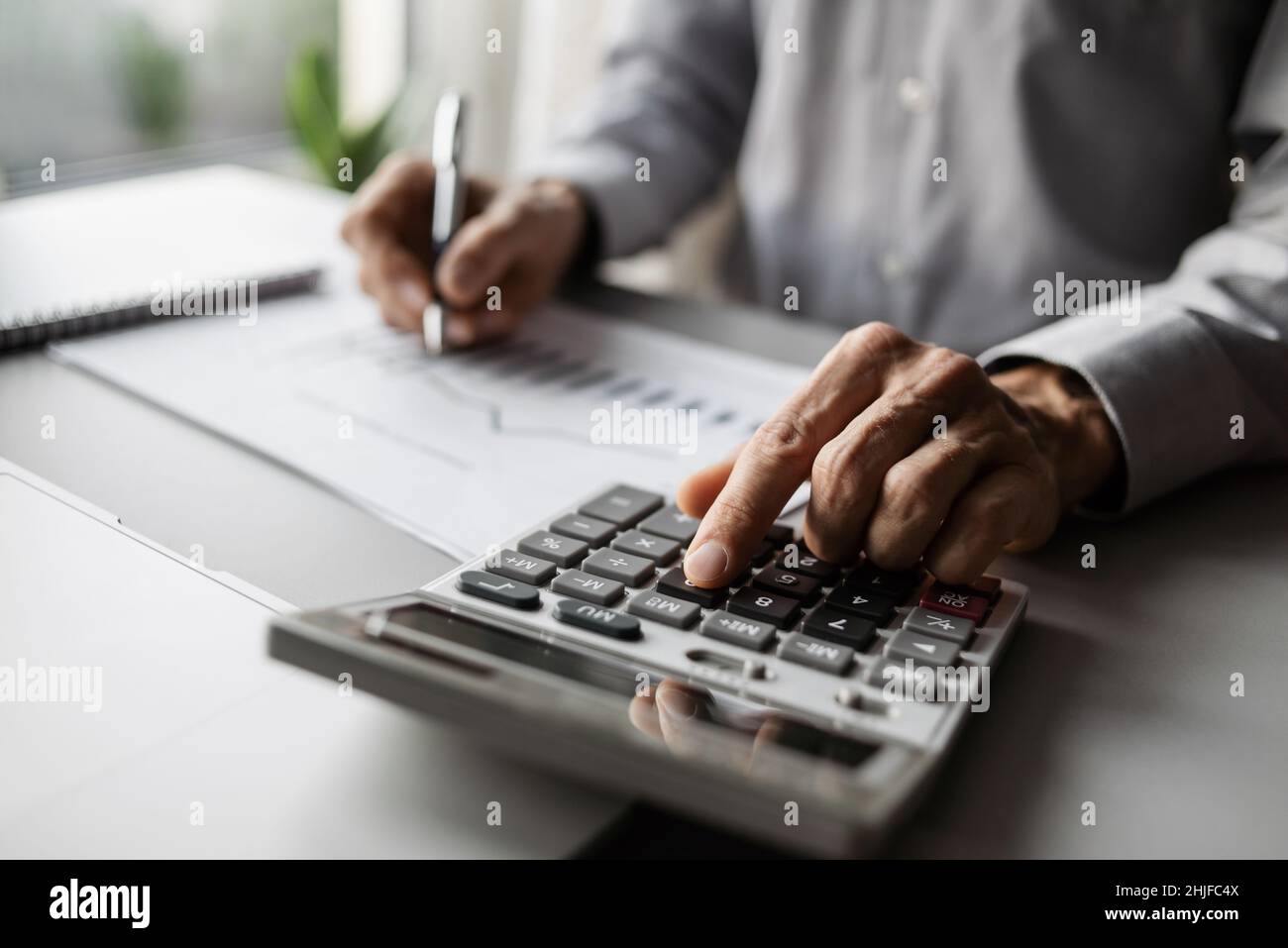 Businessman using calculator in office. Man accountant, financial ...