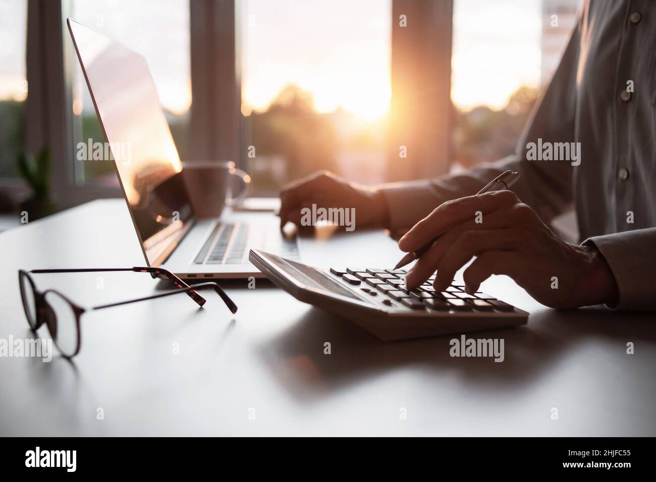 Businessman using calculator in office. Man accountant, financial ...