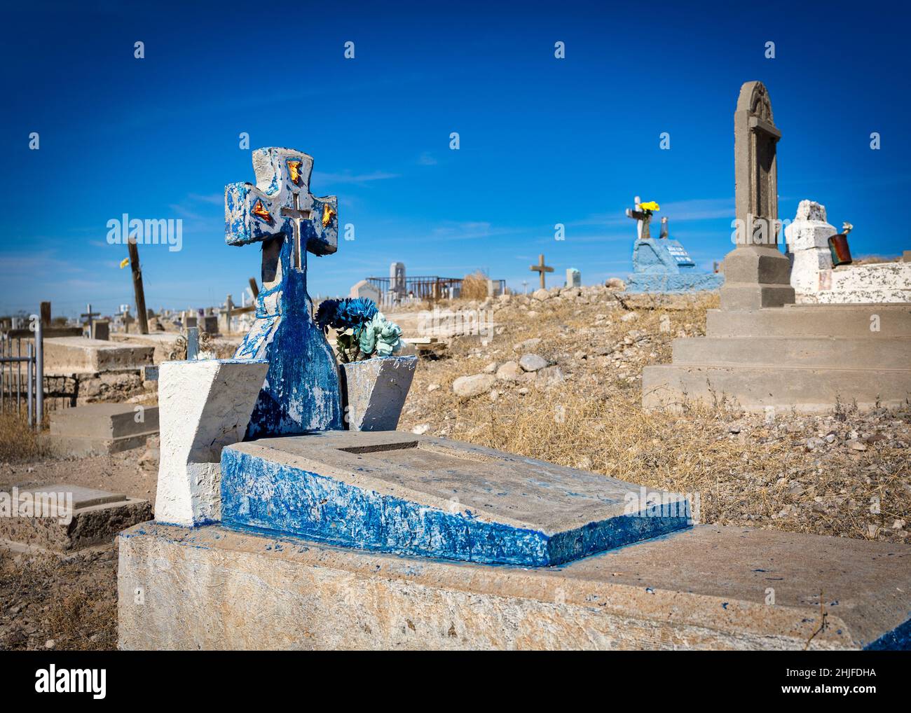 A painted blue grave at historic the Smeltertown Cemetery in El Paso ...