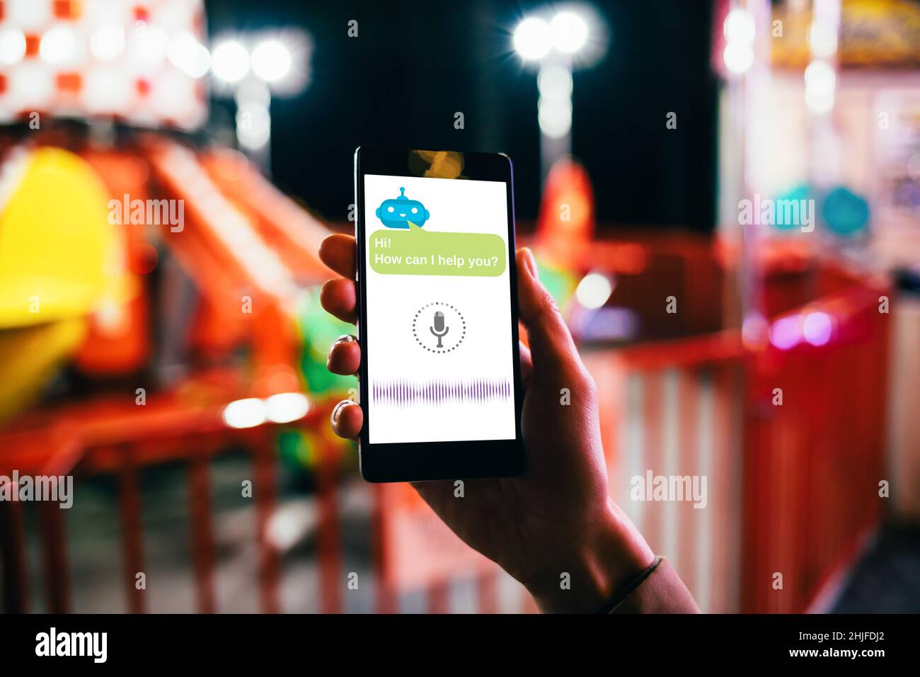 Artificial intelligence chat bot concept, female hand holding ...