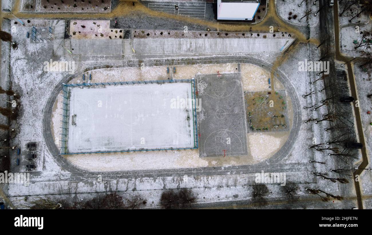 Snow football pitch. Football field top view in the winter filming on ...