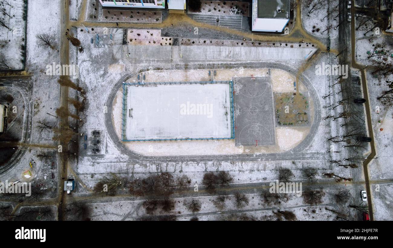 Snow football pitch. Football field top view in the winter filming on ...