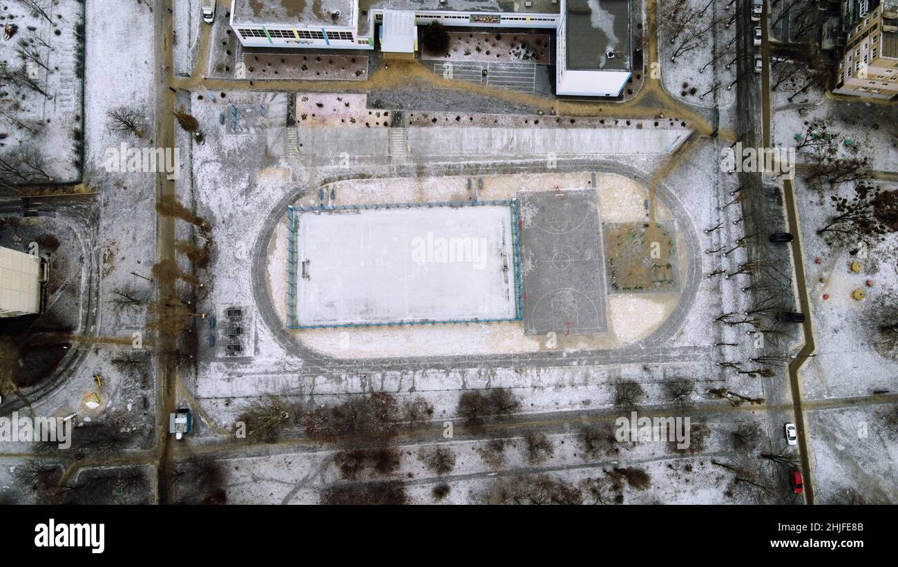 Snow football pitch. Football field top view in the winter filming on ...