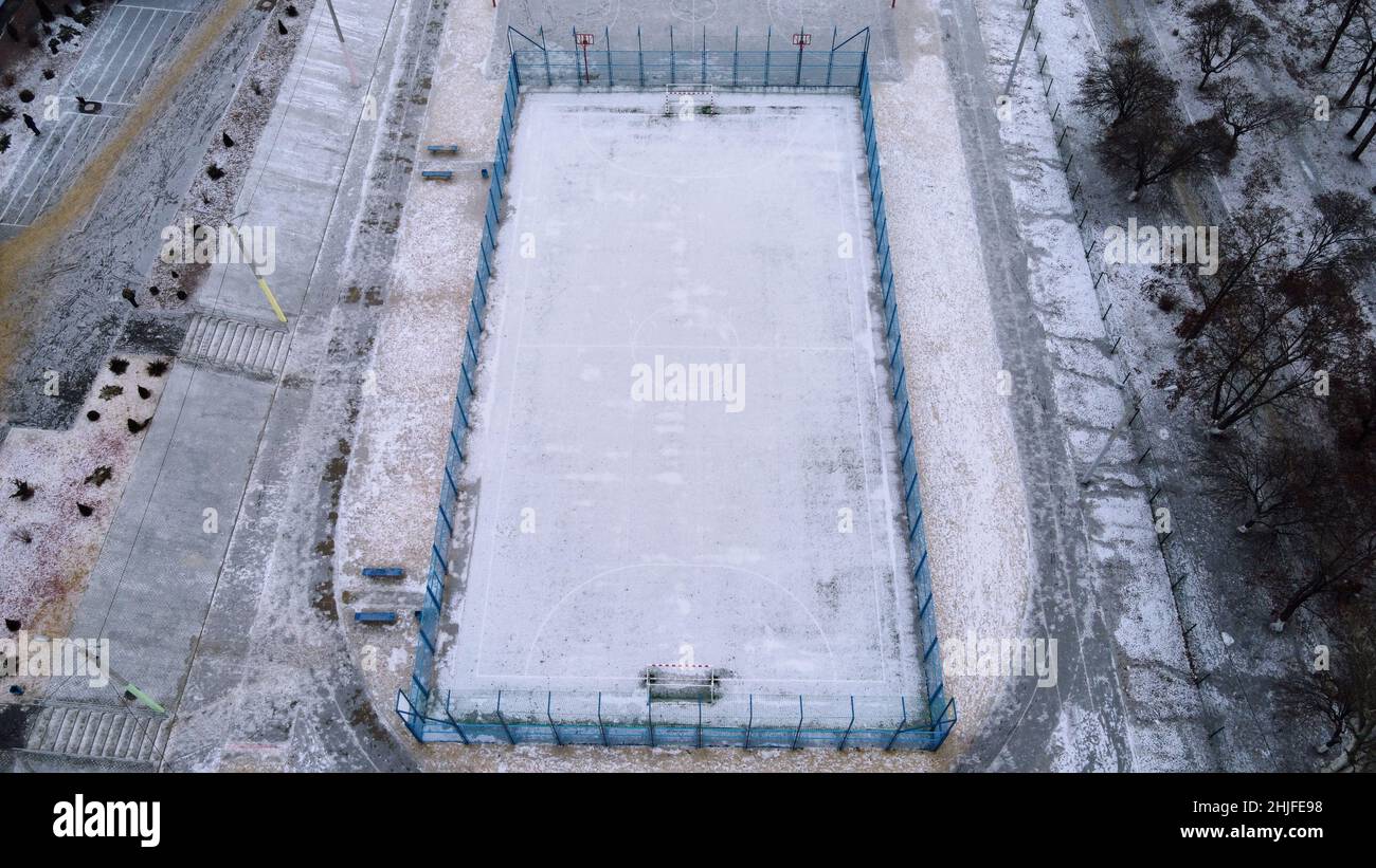 Snow football pitch. Football field top view in the winter filming on ...