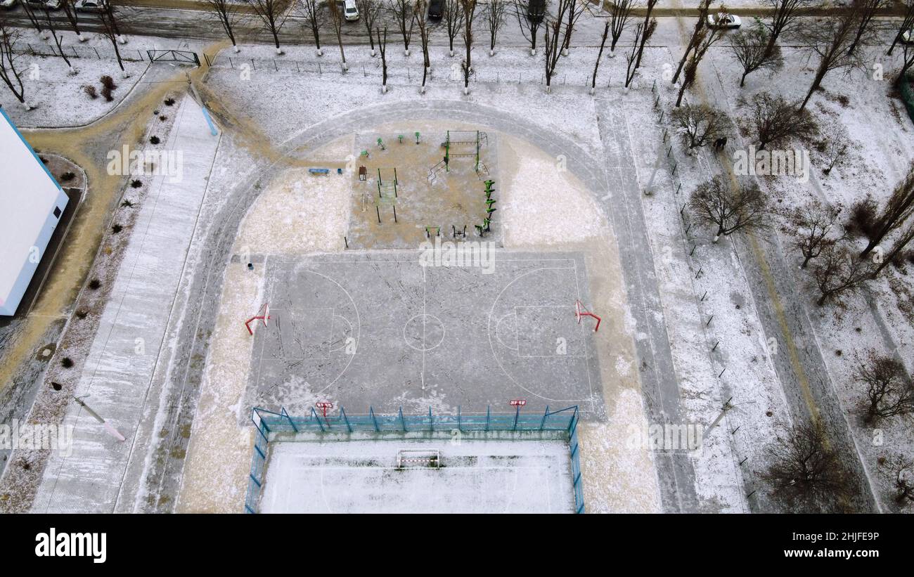 Snow basketball pitch. Basketball field top view in the winter filming ...