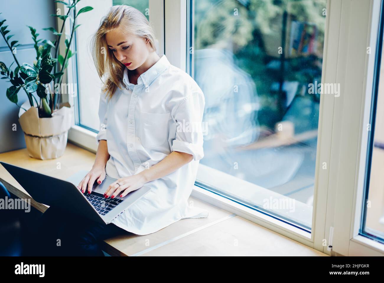Laptop typing plant woman hi-res stock photography and images - Alamy