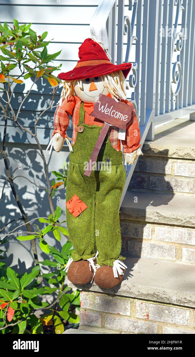 Welcoming Scarecrow for the fall season,with Red Hat & welcome sign ...