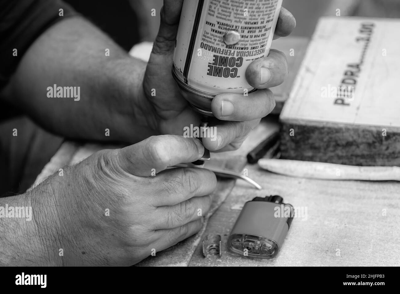 Refilling a lighter Stock Photo - Alamy