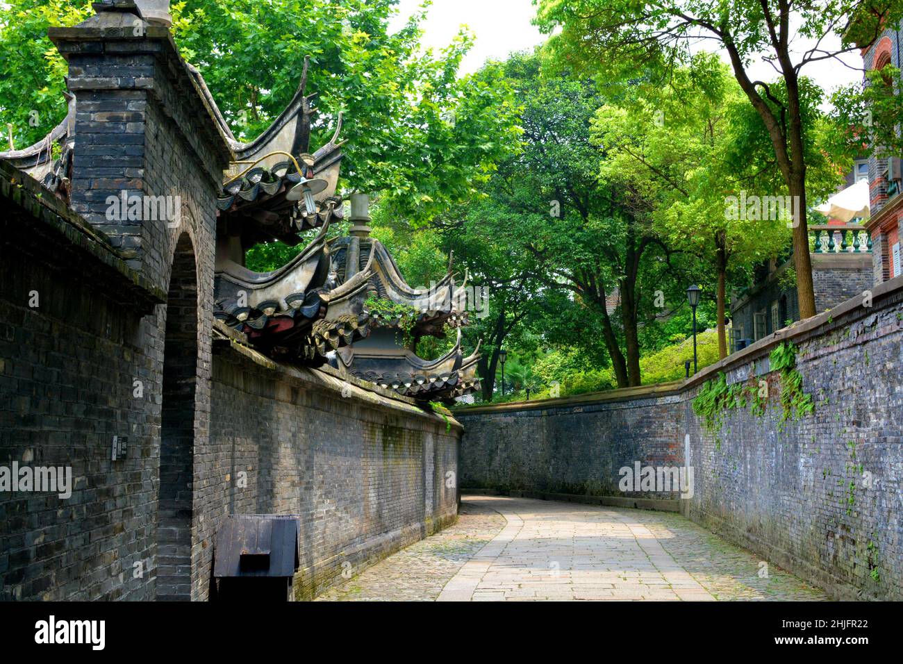Beautiful shot of a narrow walking road and some Chinese architectural ...