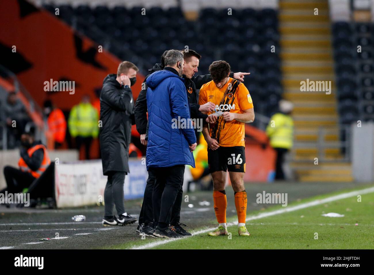 Ryan Longman #16 of Hull City receives instructions from the Hull City ...