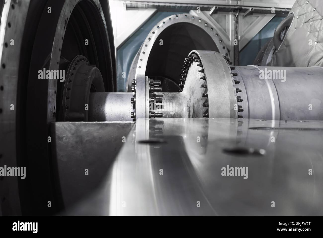 The rotor of a gas turbine compressor with a bolted coupling half ...