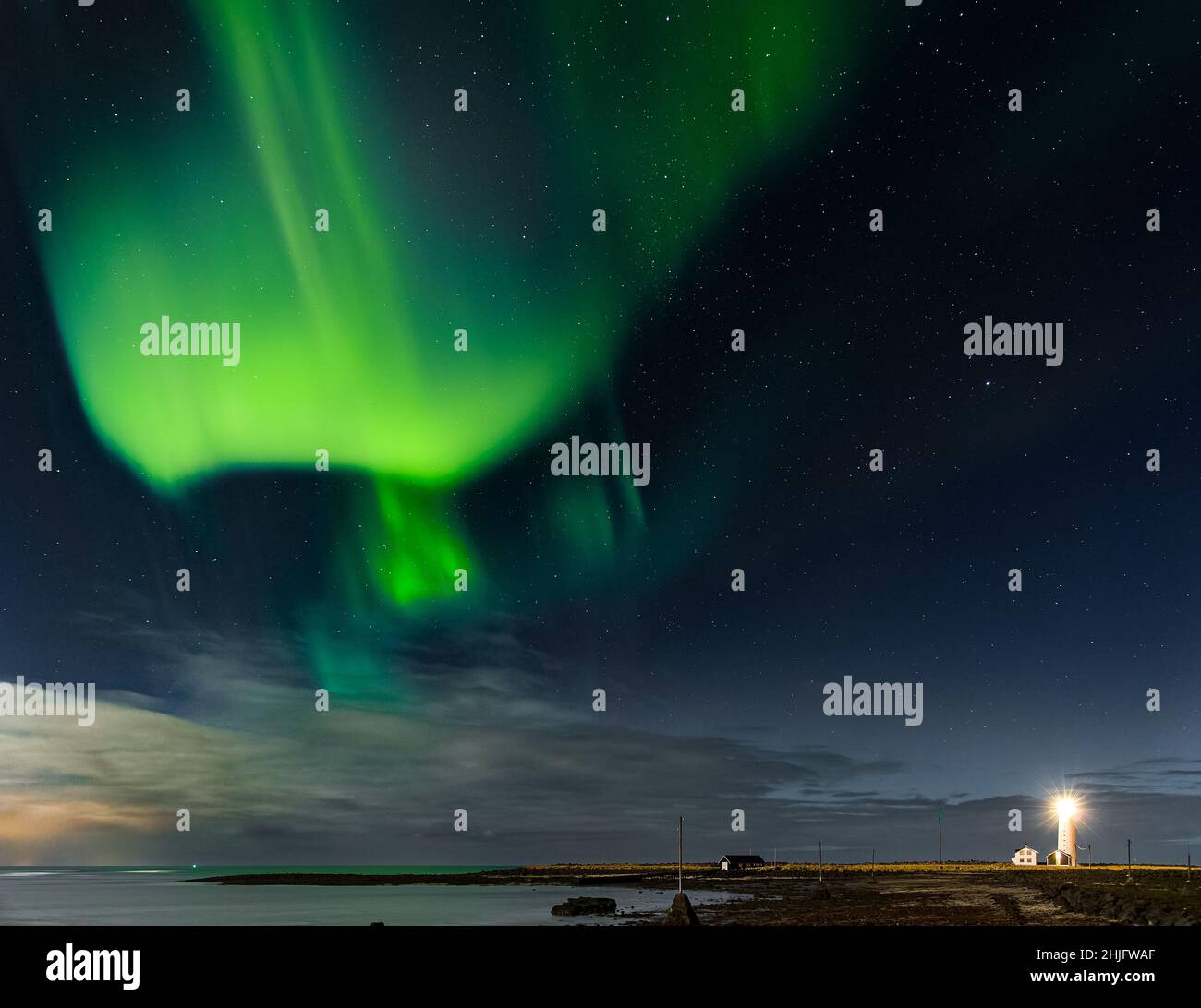 Aurora Borealis displaying above Grotta Island lighthouse in the city ...