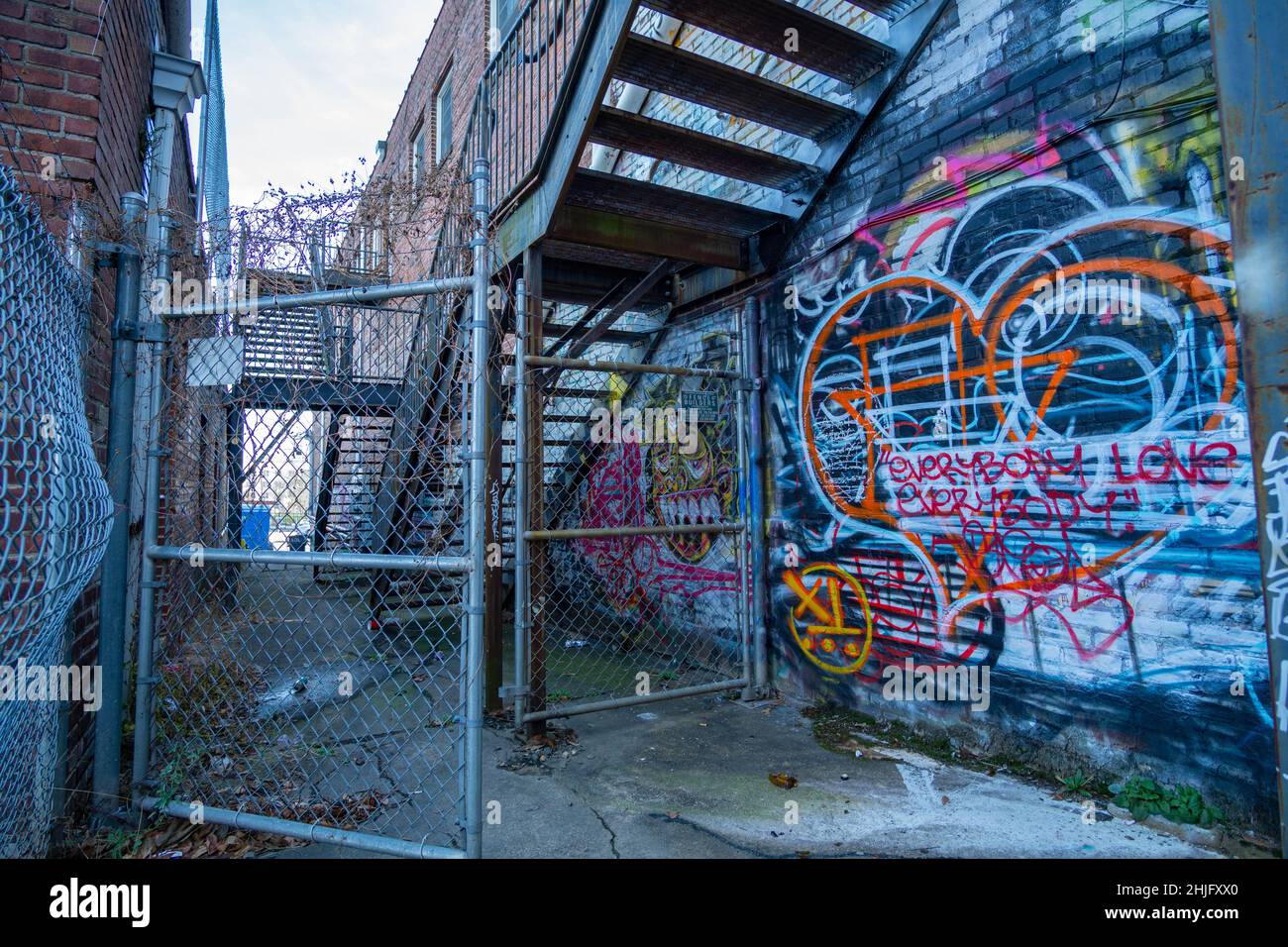 Graffiti and a chain-link fence in a Winston-Salem alley Stock Photo ...