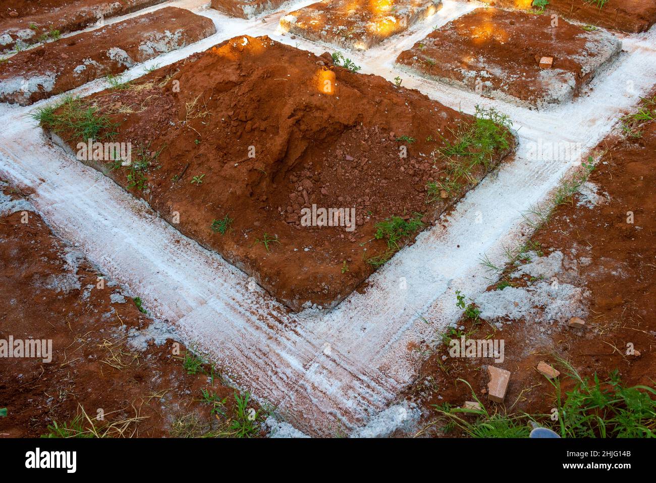 Diagonal top view of concrete filled foundation trenches at a building ...