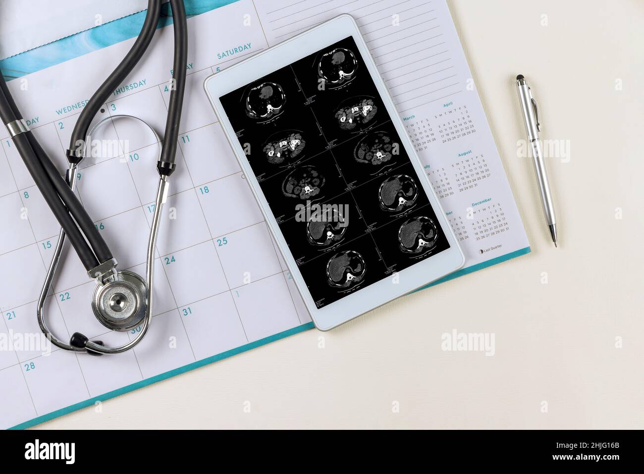 MRI scan of a human head showing in digital tablet result for patient ...