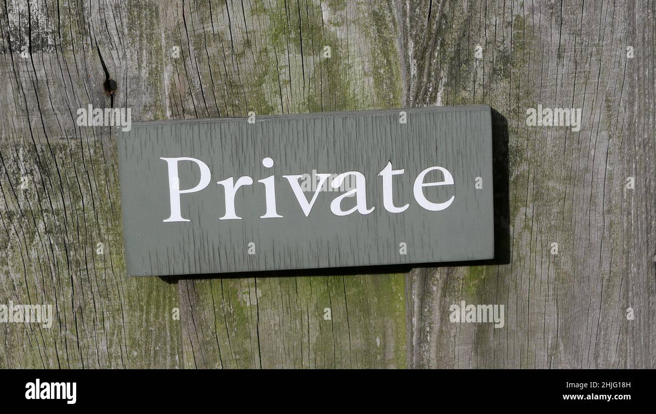 Wooden sign saying the word Private attached to wooden background Stock ...