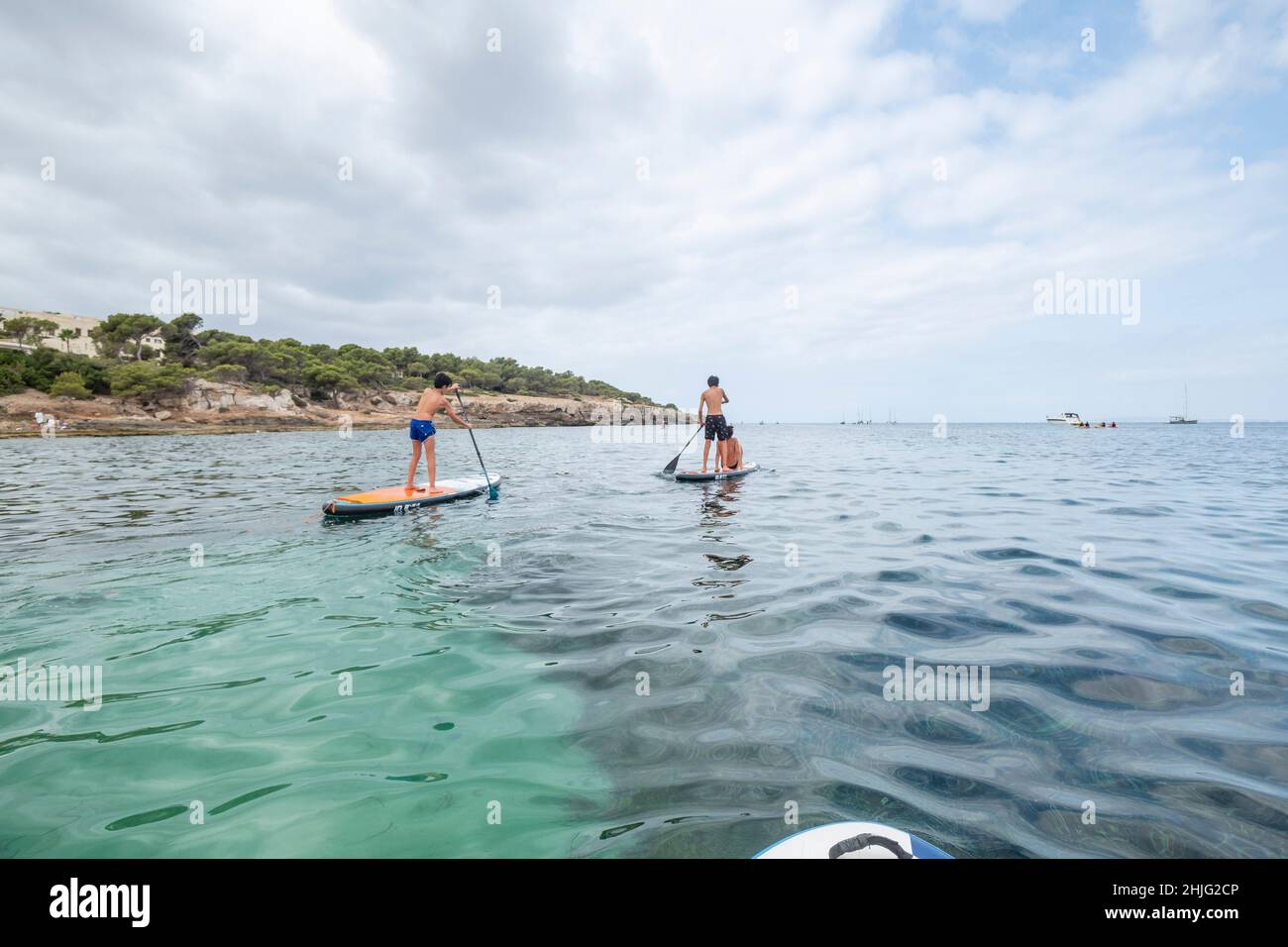 Paddle surfing in the Caló de Sant Antoni, S Arenal de Llucmajor ...