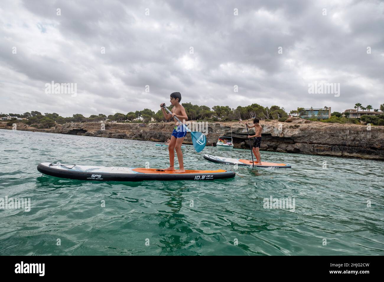 Paddle surfing in the Caló de Sant Antoni, S Arenal de Llucmajor ...