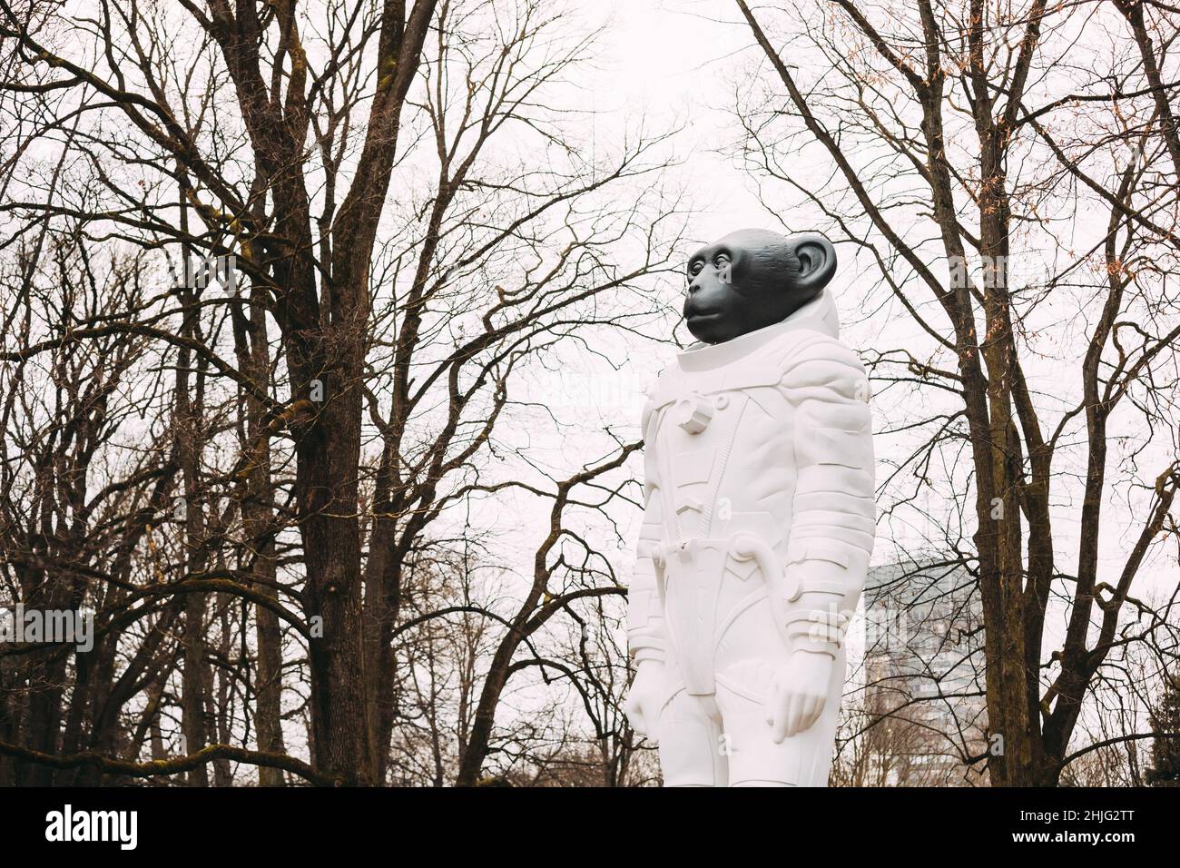 Riga, Latvia. Monkey statue in a spacesuit in Kronvalda park. Statue is ...