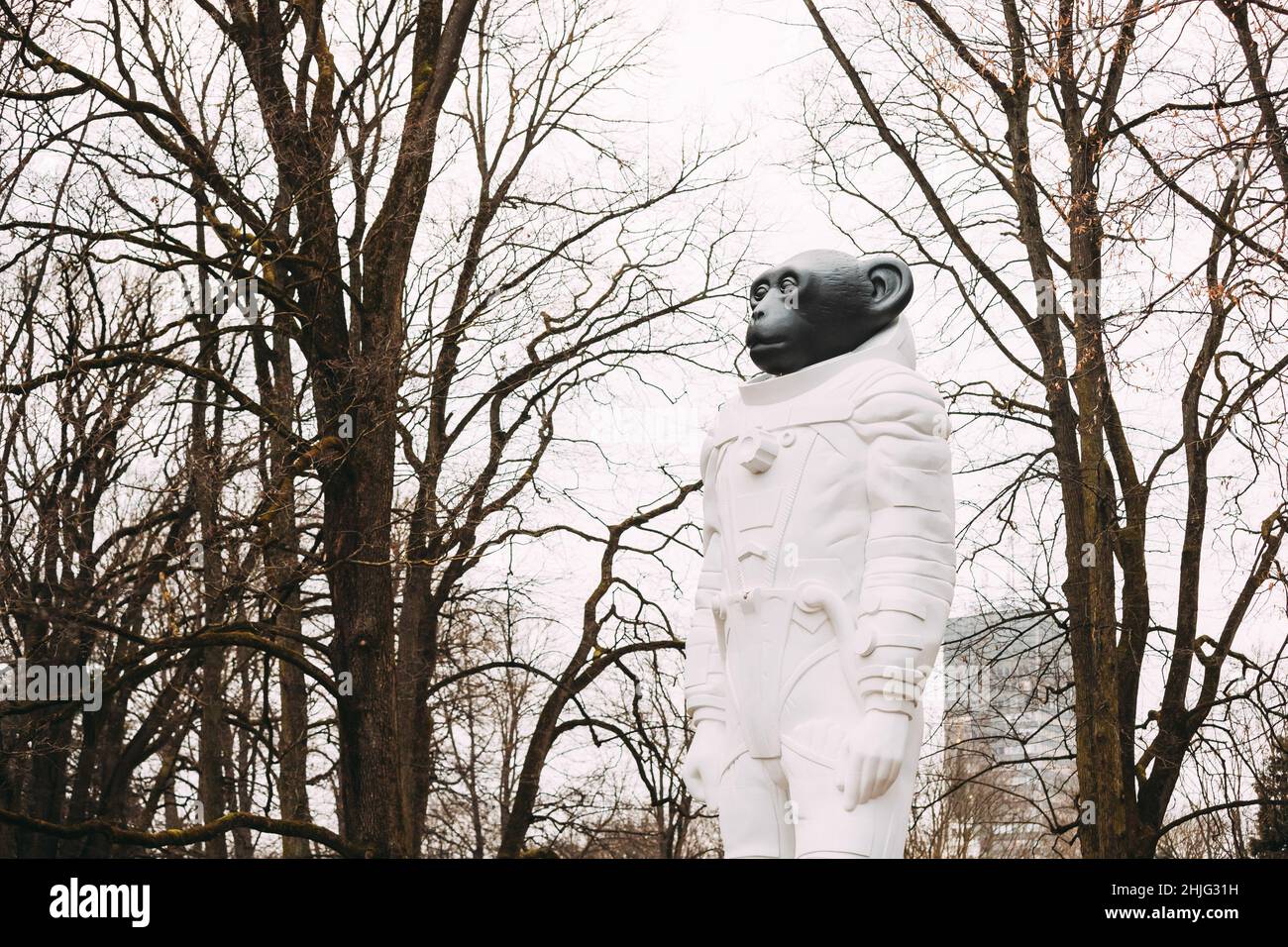 Riga, Latvia. Monkey statue in a spacesuit in Kronvalda park. Statue is ...