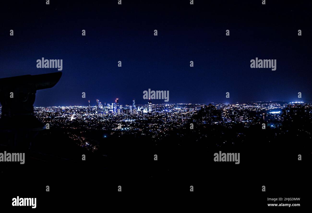 The cityscape of Mount Coot-tha covered in lights at night in ...