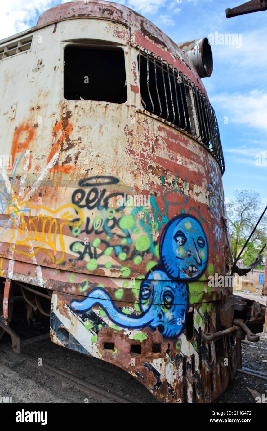 Abandoned old train with rust and graffitis Stock Photo - Alamy