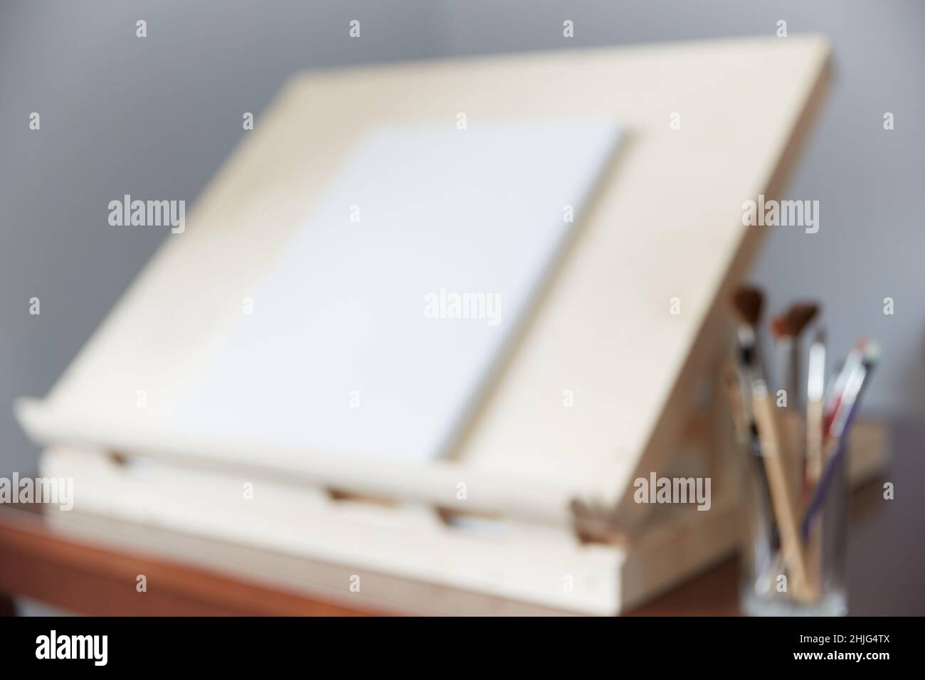 easel is out of focus. background for a text on teaching drawing in an ...