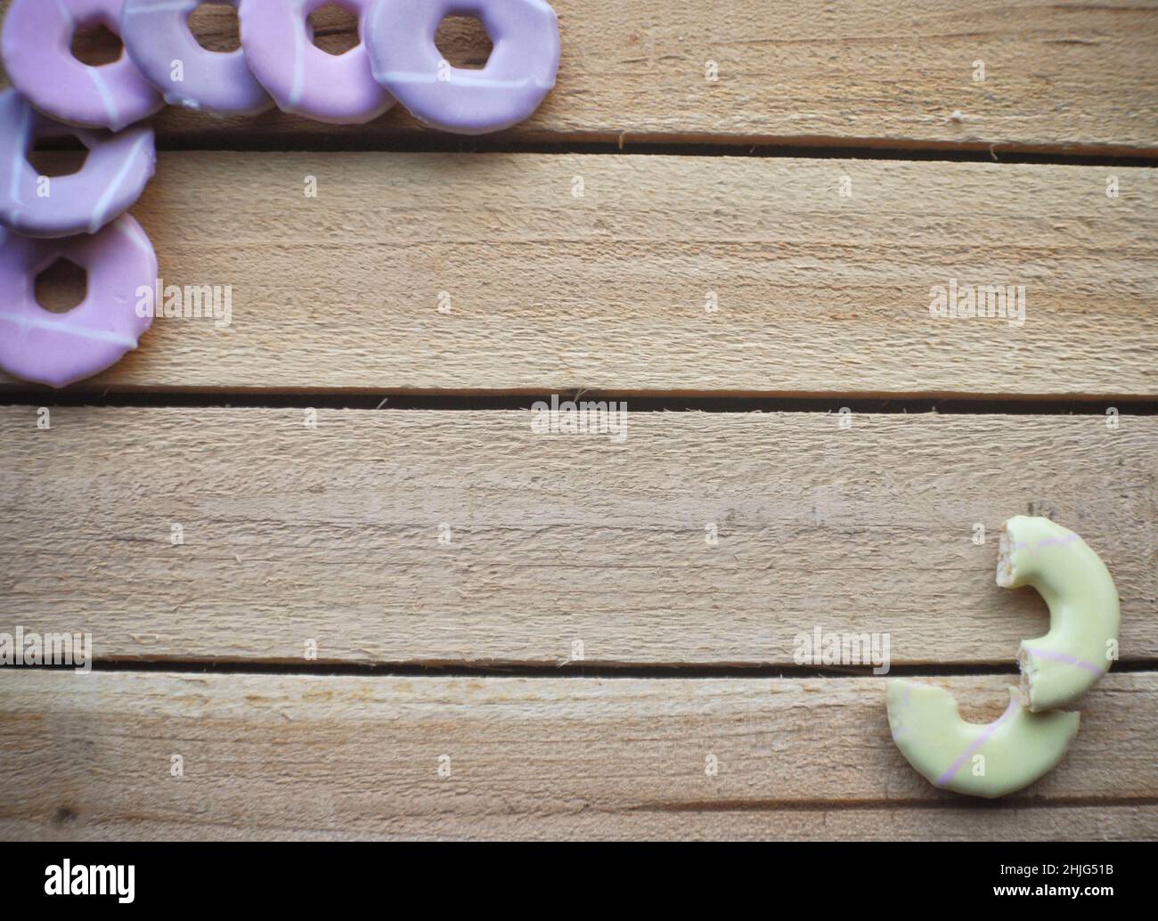 Party ring biscuits by FOX's set against a wooden background with copy ...